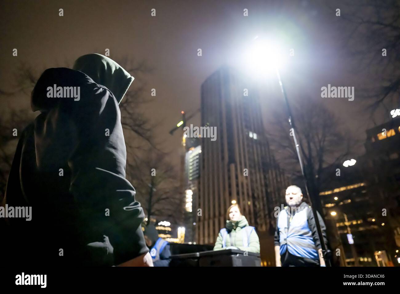 THE HAGUE - Homeless people receive a hot meal from aid workers in the ...