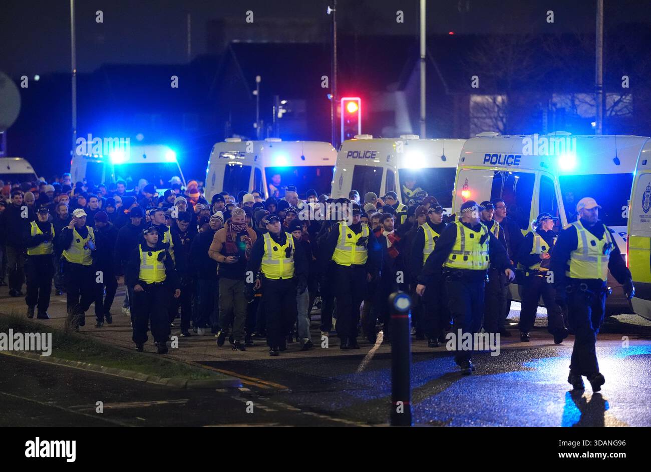 Police march the Roma fans to the ground before the UEFA Europa League ...