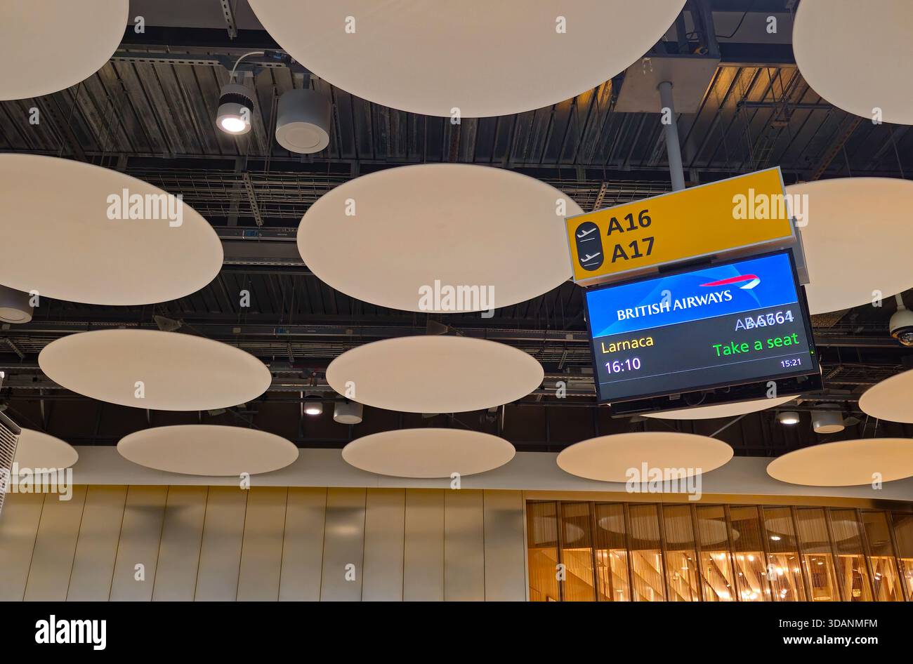 Airport flight information display board showing british airways flight ...