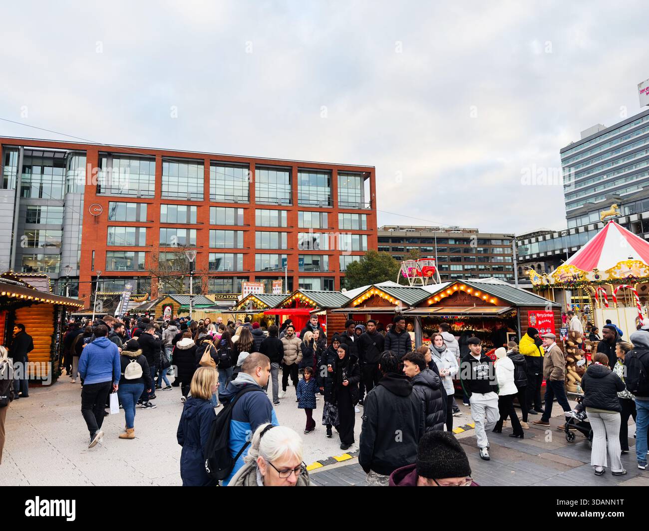 Manchester, UK - November 16, 2025: People stroll through festive ...