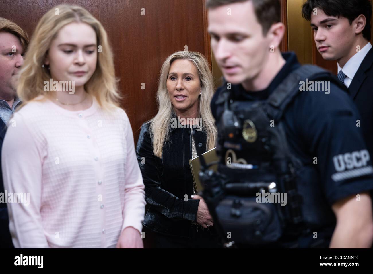Rep. Marjorie Taylor Greene (R-Ga.) is seen in an elevator with aides ...