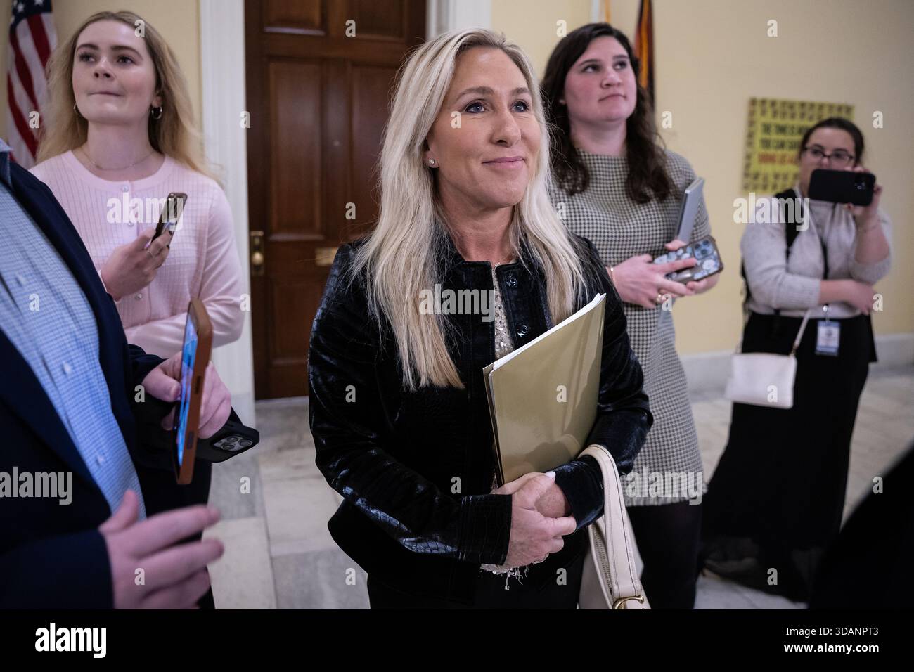 Rep. Marjorie Taylor Greene (R-Ga.) waits for an elevator as she ...