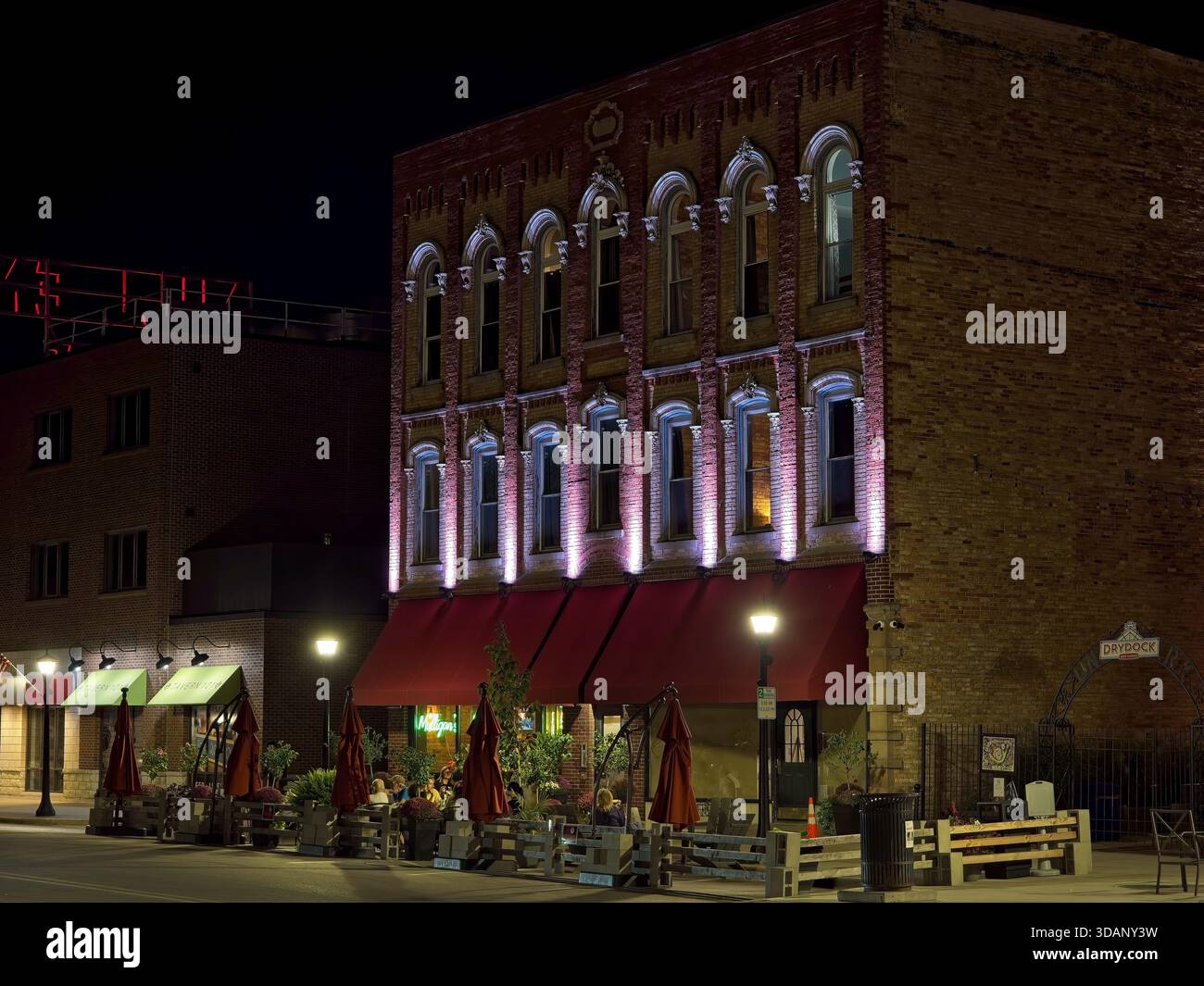 Historic 1867 Tanner building on Center Ave at night in downtown Bay ...