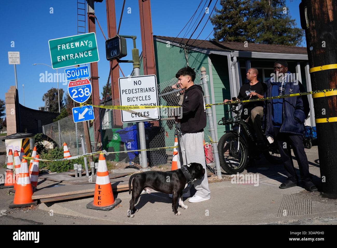 People watch from a distance at the scene of a gas explosion Thursday ...