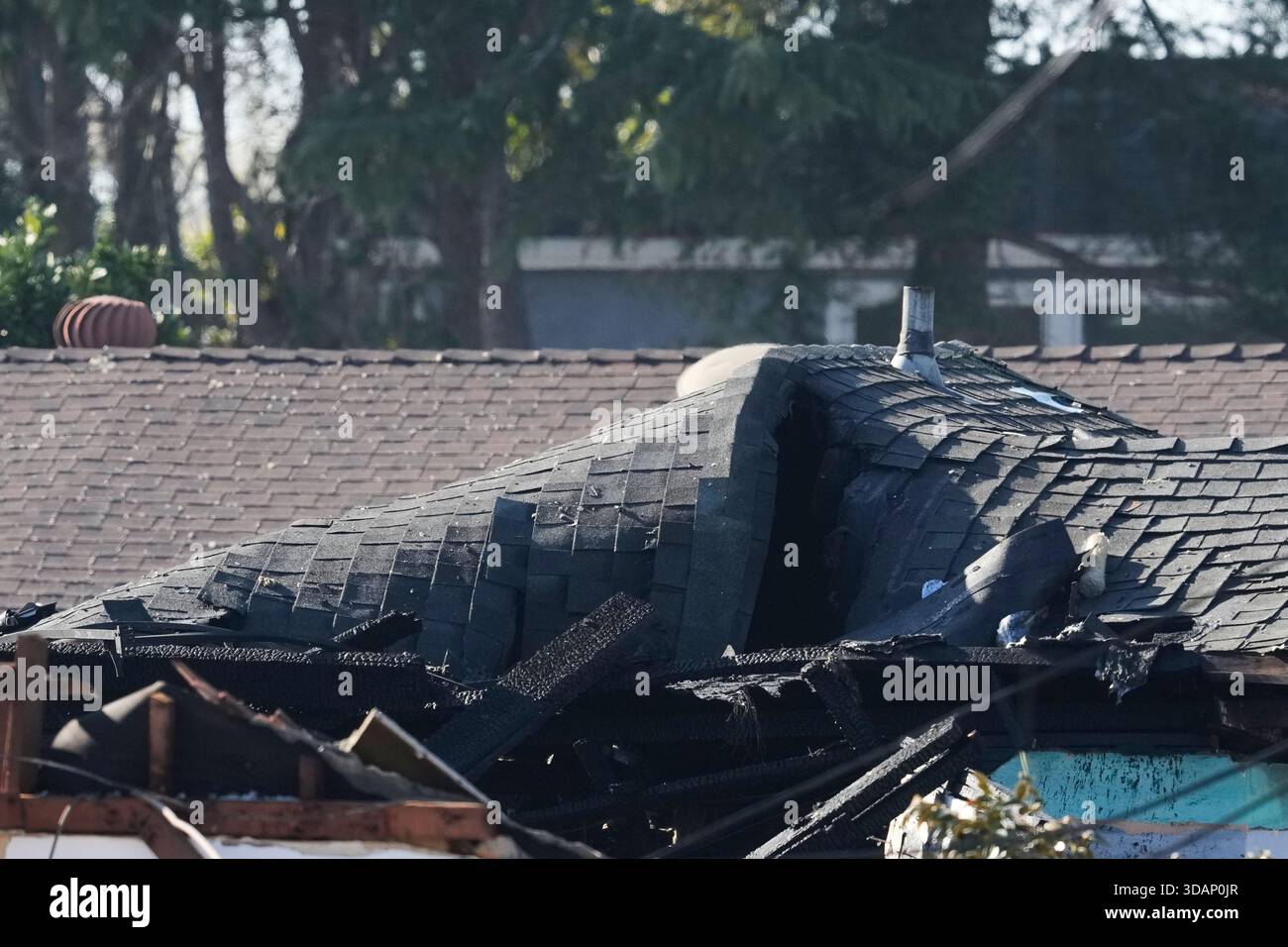 A damaged rooftop is shown at the scene of a gas explosion Thursday ...