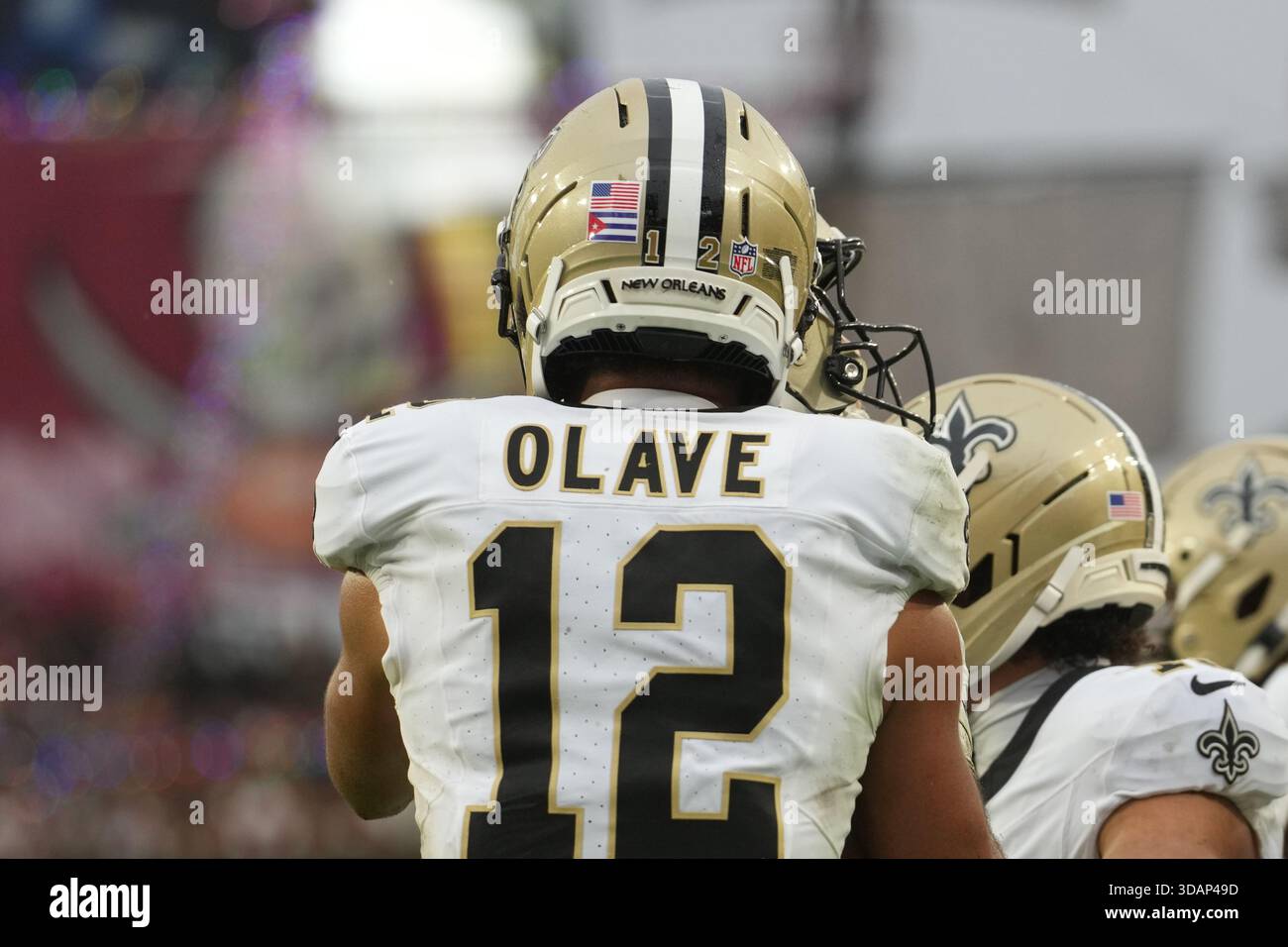 New Orleans Saints wide receiver Chris Olave (12) wears a Puerto Rico ...