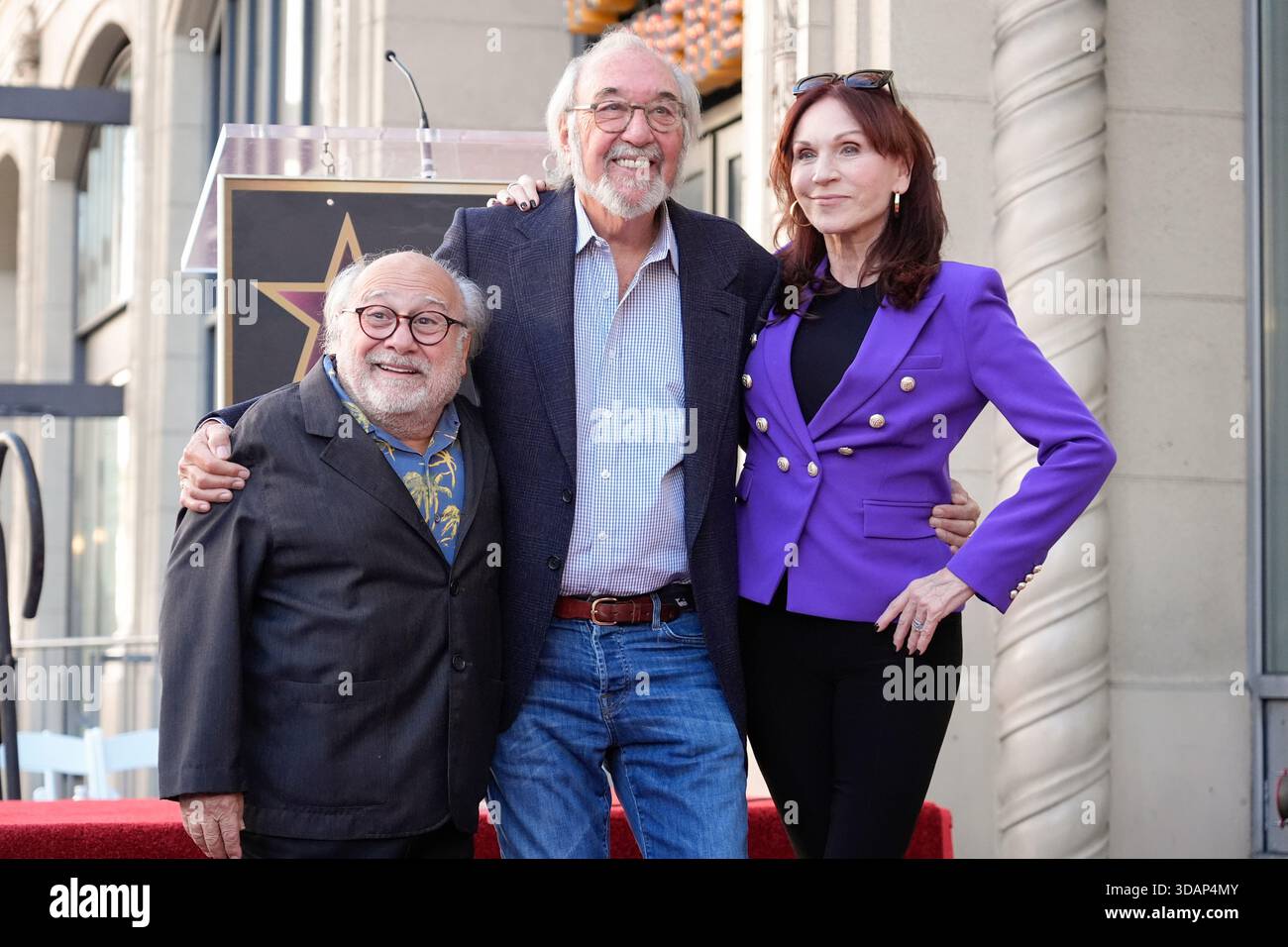 Danny DeVito, from left, James L. Brooks, and Marilu Henner pose with ...