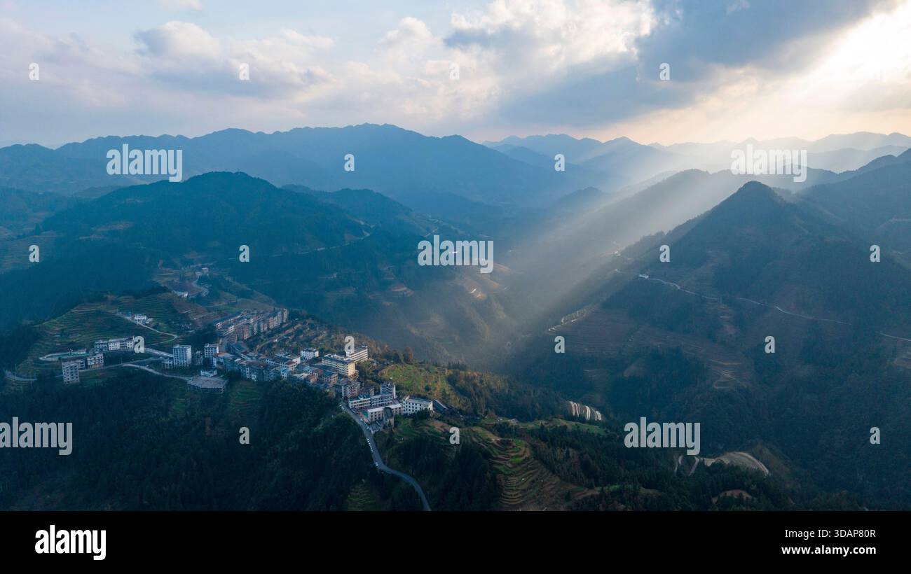 CONGJIANG, CHINA - DECEMBER 9, 2025 - Sunlight shines through the ...