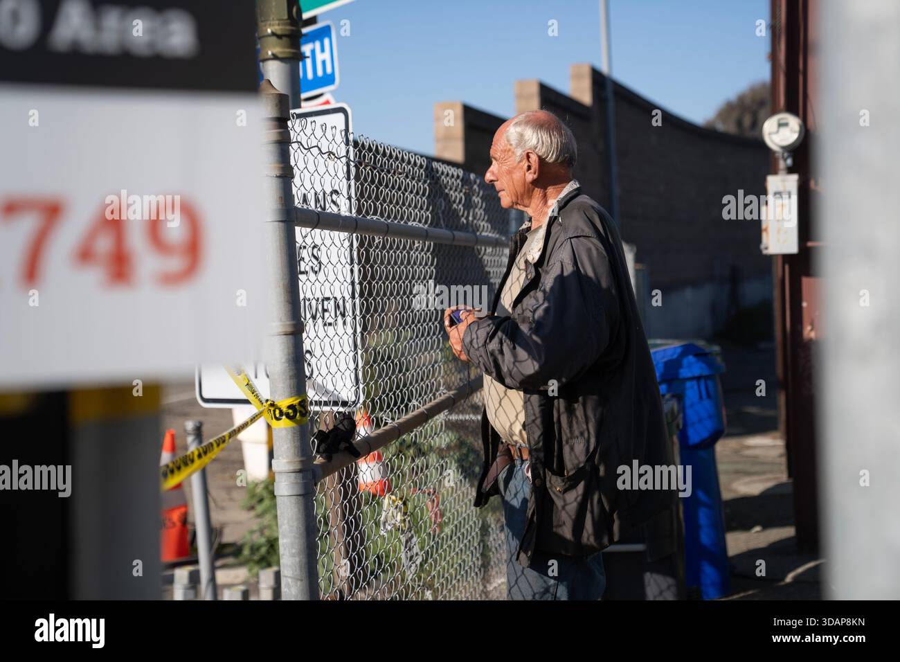 Steve Camp, of San Leandro, observes the site of the explosion on the ...