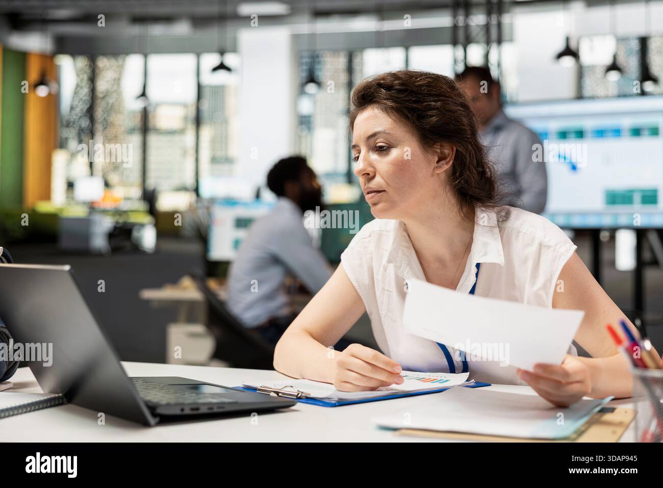 Employee comparing data on hi-res stock photography and images - Alamy