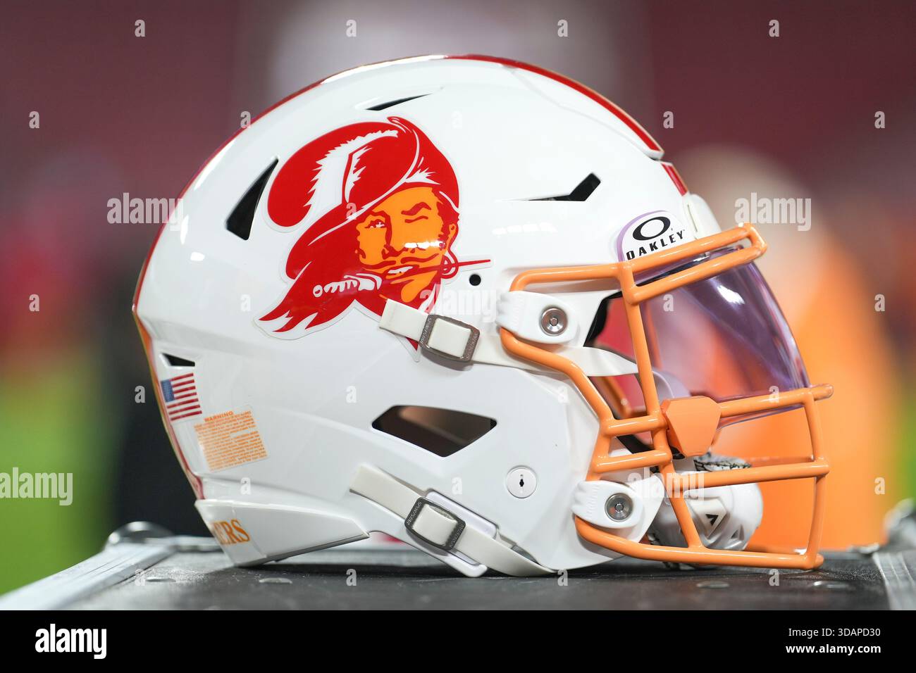 A throwback Tampa Bay Buccaneers helmet rests near the sidelines before ...