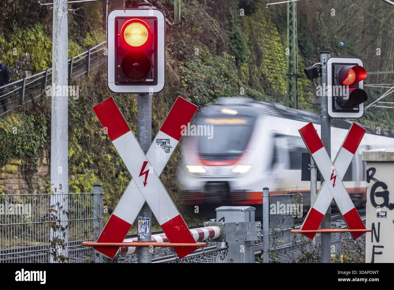 Rail crossing with regional train at Bad Wimpfen station. Flashing ...