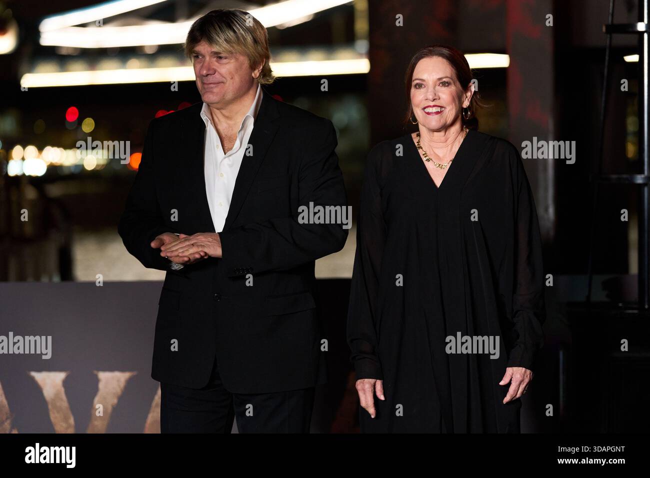 Simon Franglen, left, and Deborah Lynn Scott pose for photographers ...