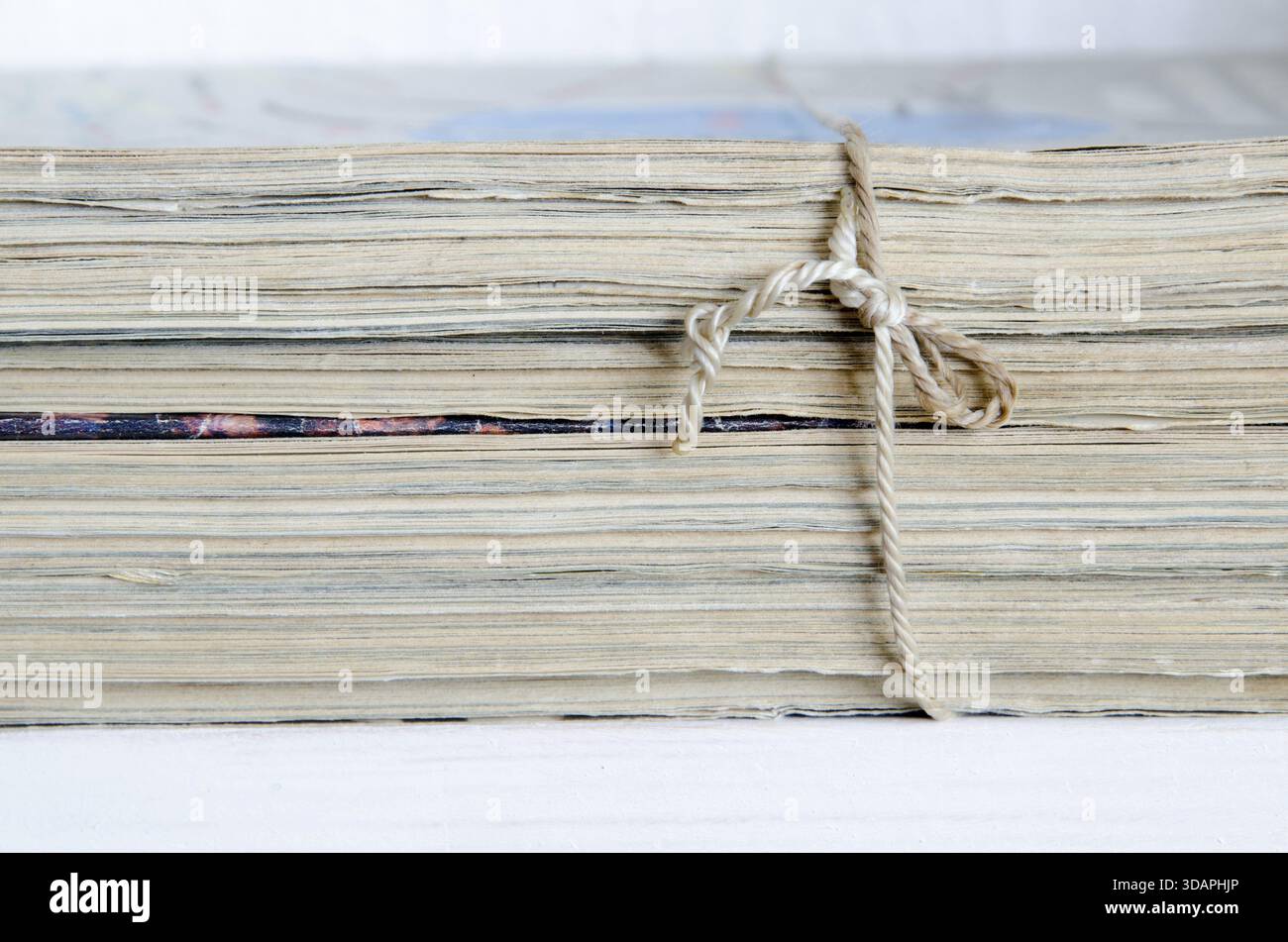 Vintage magazines stack tied with old twine Stock Photo - Alamy