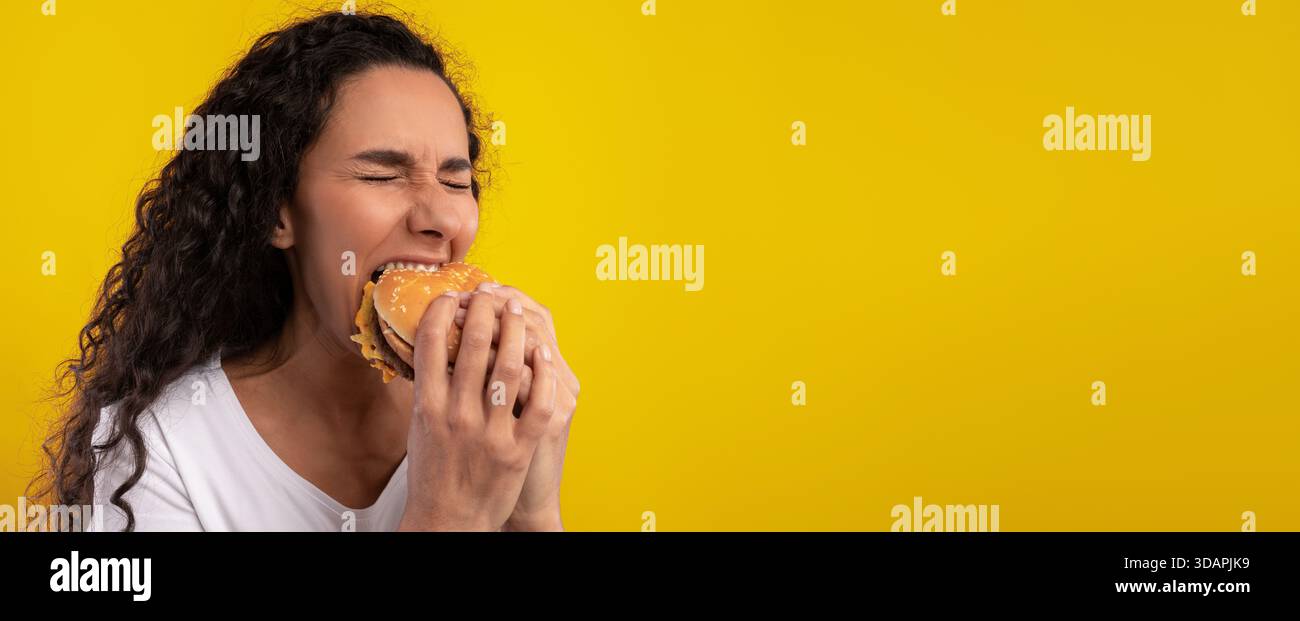 Woman enjoying big bite hi-res stock photography and images - Alamy