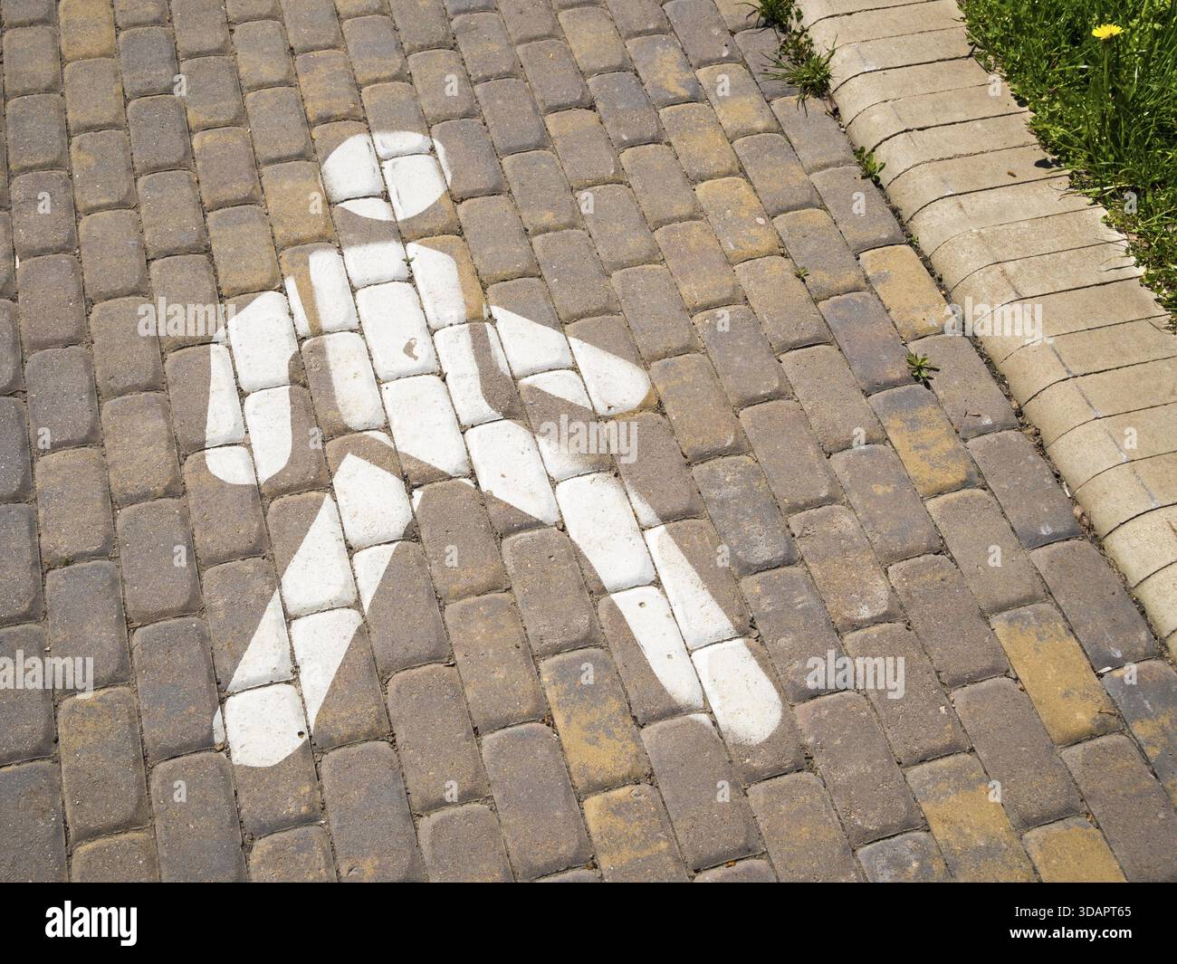 Pedestrian pathway sign on brick road pavement Stock Photo - Alamy