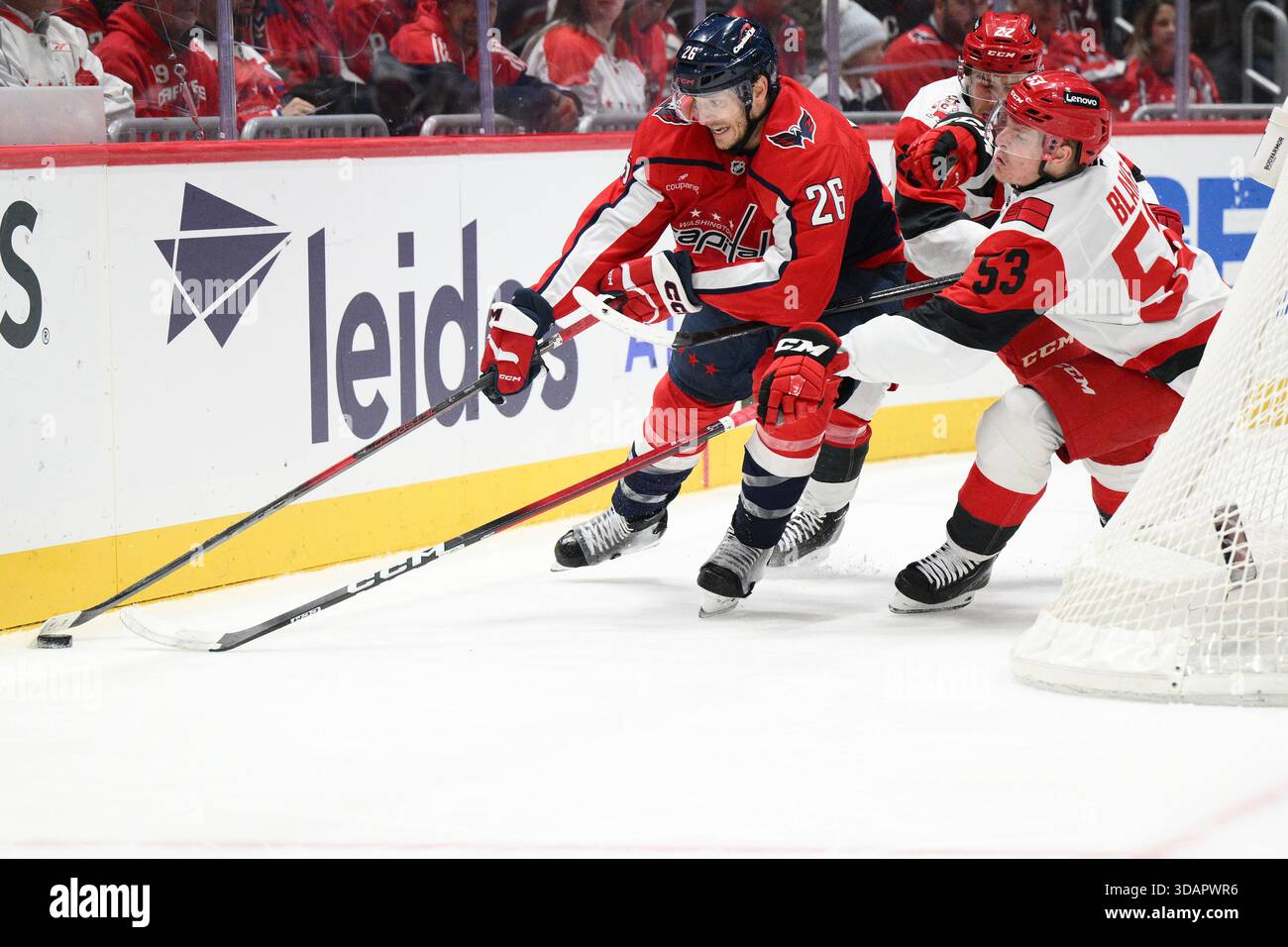Washington Capitals center Nic Dowd (26) and Carolina Hurricanes right ...