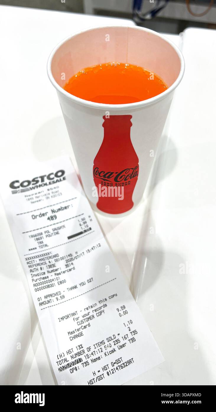 Coca-Cola beverage in a white cup with Costco logo and receipt on a ...