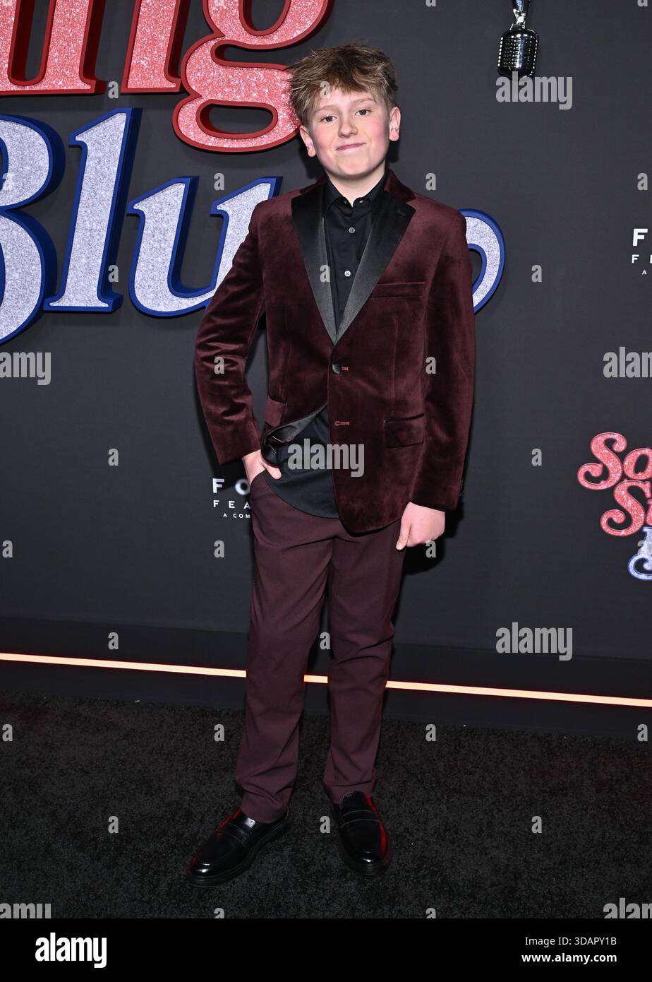 Hudson Hensley attends the premiere of "Song Sung Blue" at AMC Lincoln ...