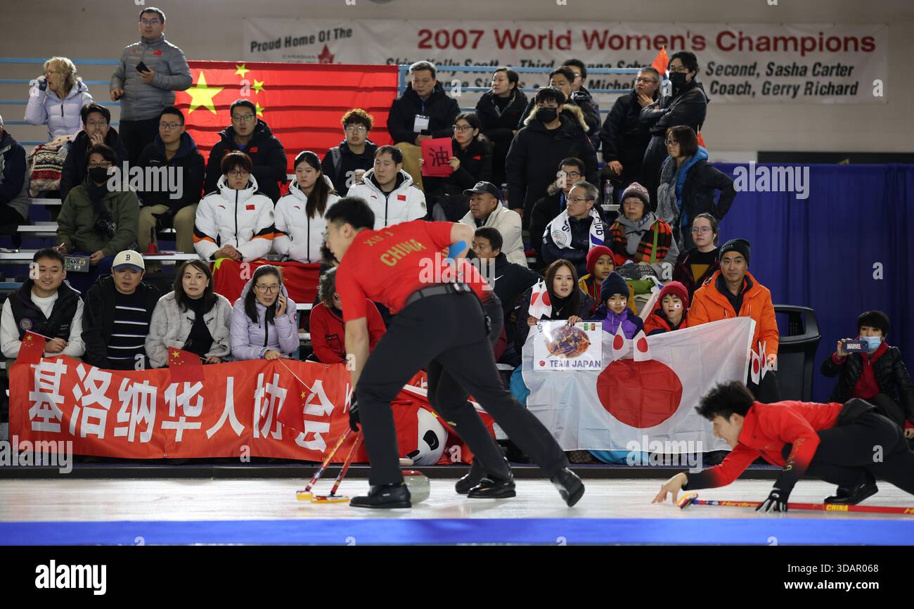 Spectators cheer for China's national team during the men's second ...