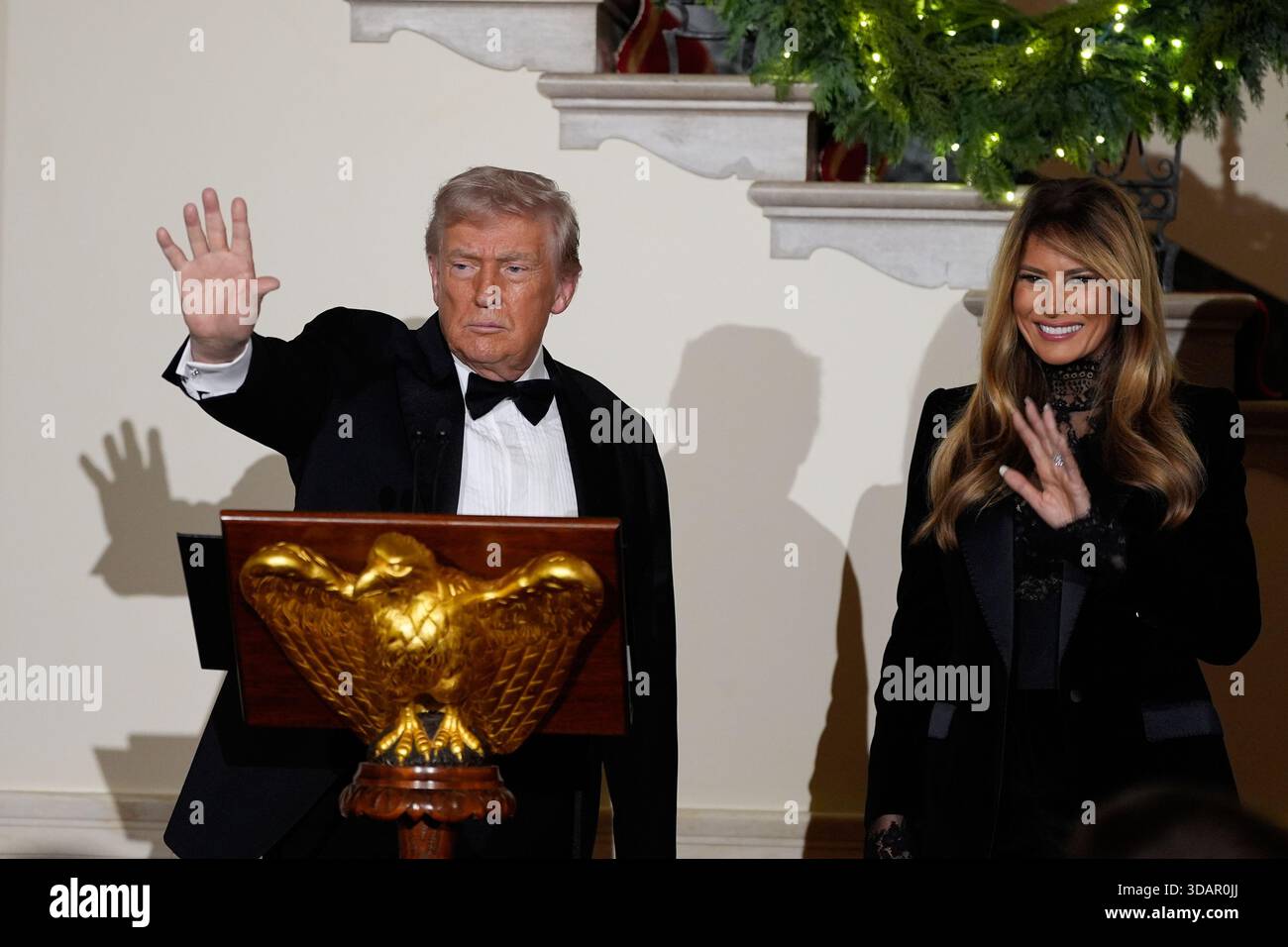 President Donald Trump and first lady Melania wave to guests in the ...