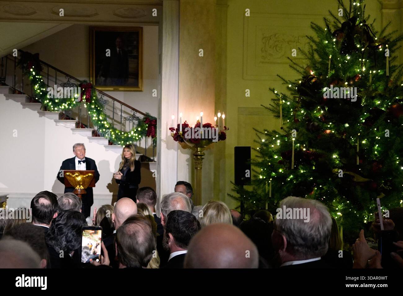 President Donald Trump and first lady Melania welcome guests in the ...