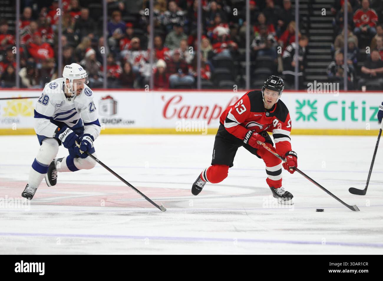 New Jersey Devils' Jesper Bratt (63) skates with the puck against Tampa ...
