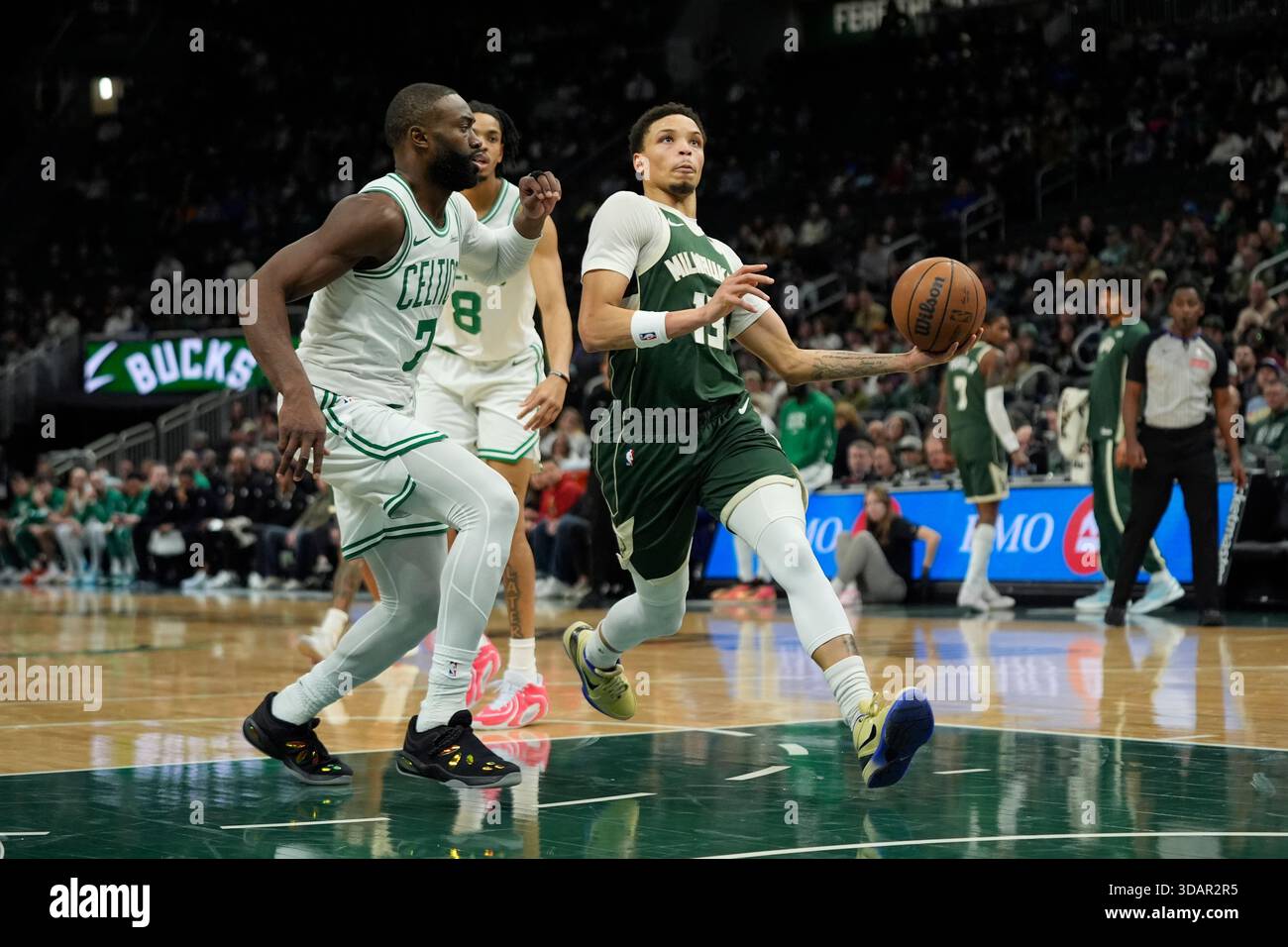 Milwaukee Bucks' Ryan Rollins (13) drives to the basket against Boston ...