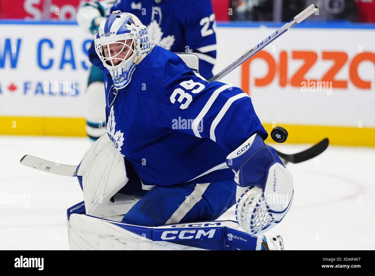 Toronto Maple Leafs goaltender Dennis Hildeby (35) makes a save behind ...