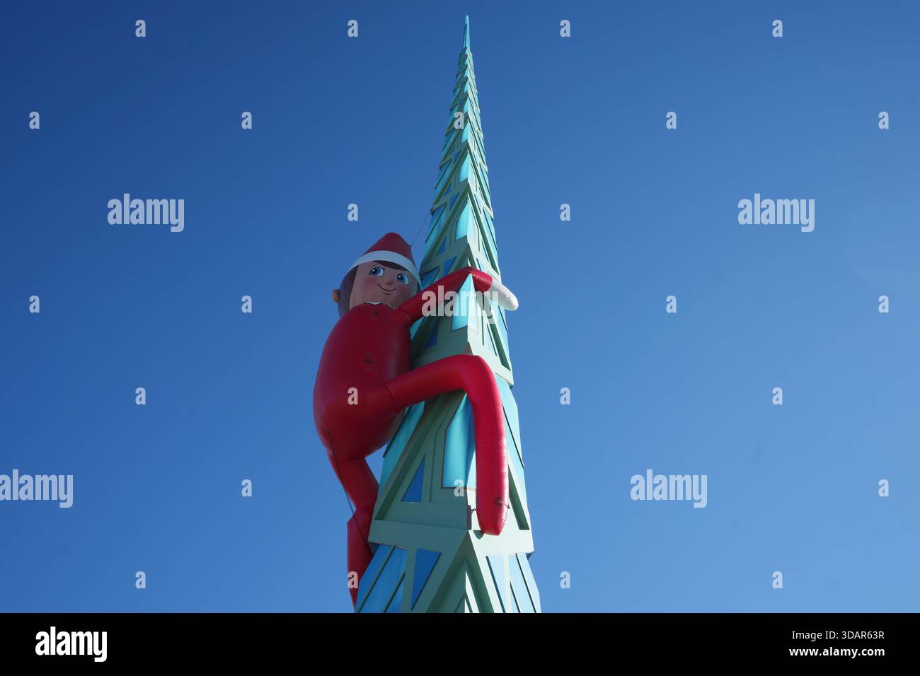 A giant Elf On The Shelf is displayed at a local shopping plaza ...