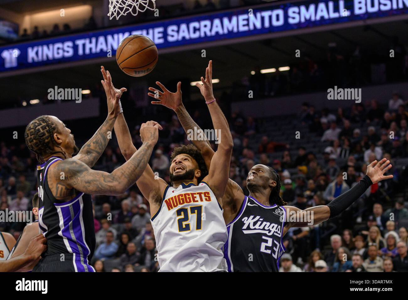 Denver Nuggets guard Jamal Murray (27) battles for a rebound with ...