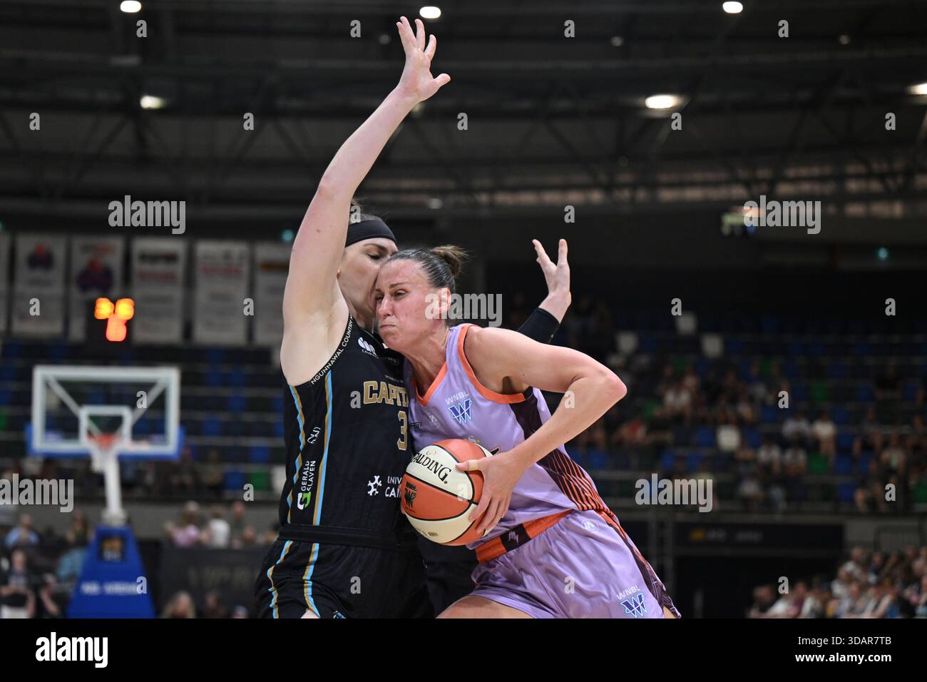 Steph Talbot of the Lightning fights for the ball with Teige Morrell of ...