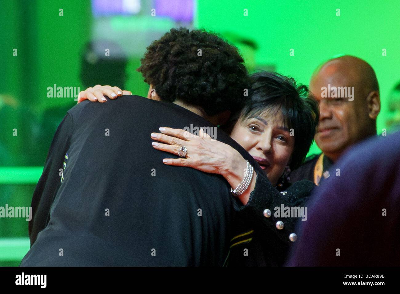New Orleans Pelicans owner Gayle Benson hugs guard Jordan Poole after ...