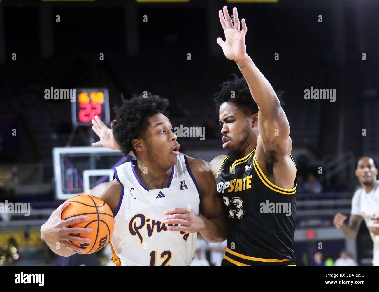 East Carolina guard Jordan Riley (12) works to move the ball inside ...