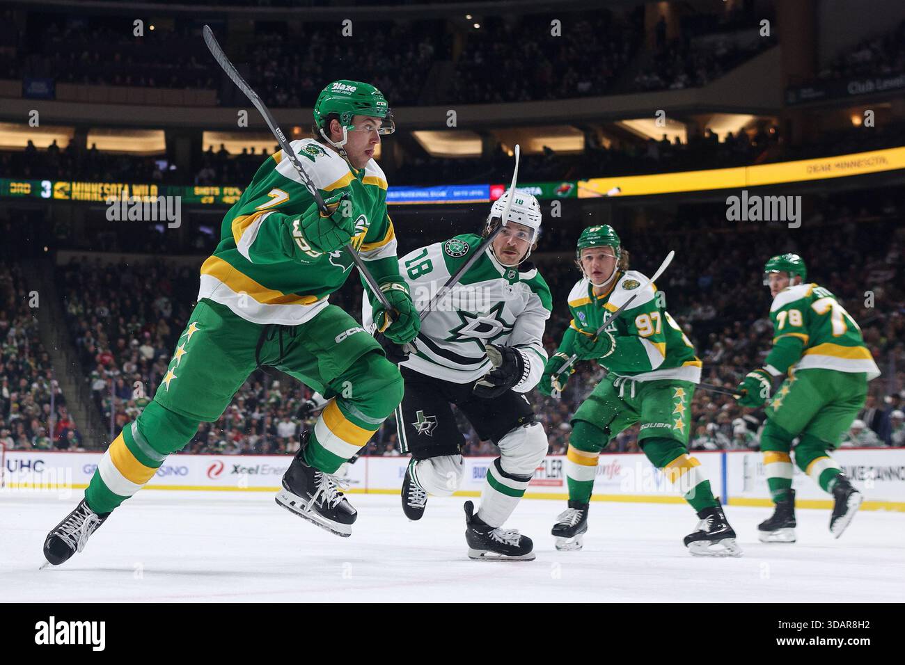 Minnesota Wild defenseman Brock Faber, left, and Dallas Stars center ...
