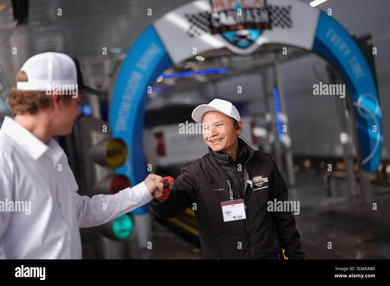 Mayflower Church Deacon Luo Changcheng, wearing a tag with the American ...