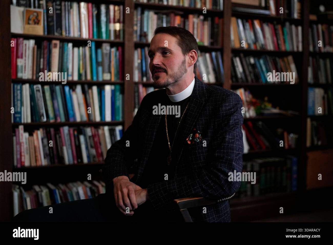 The Rev. Dr. Michael Woolf sits in his office at Lake Street Church of ...