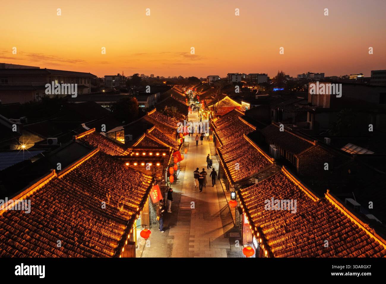 Aerial photo shows tourists strolling in Dongguan Street at night in ...