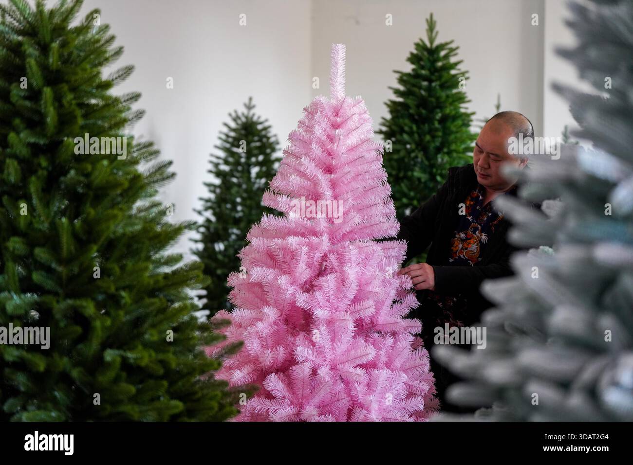 Christmas tree products are produced at a workshop in Jinhua City, east ...
