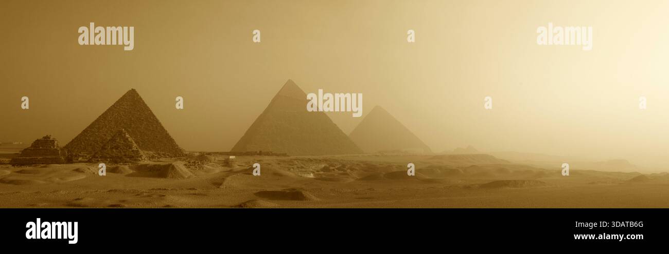 A panoramic view of The Great Pyramids at sunrise Stock Photo - Alamy