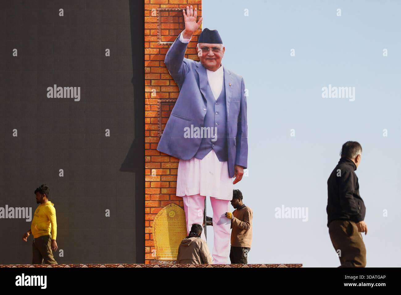 On December 12, 2025, in Bhaktapur, Nepal. Workers installs a hoarding ...
