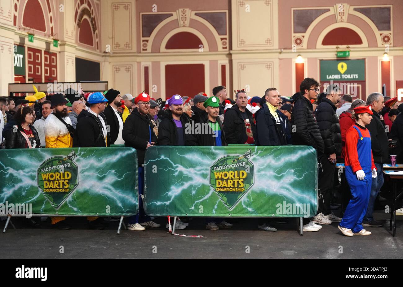 Fans in fancy dress as the queue up to enter the venue on day two of ...