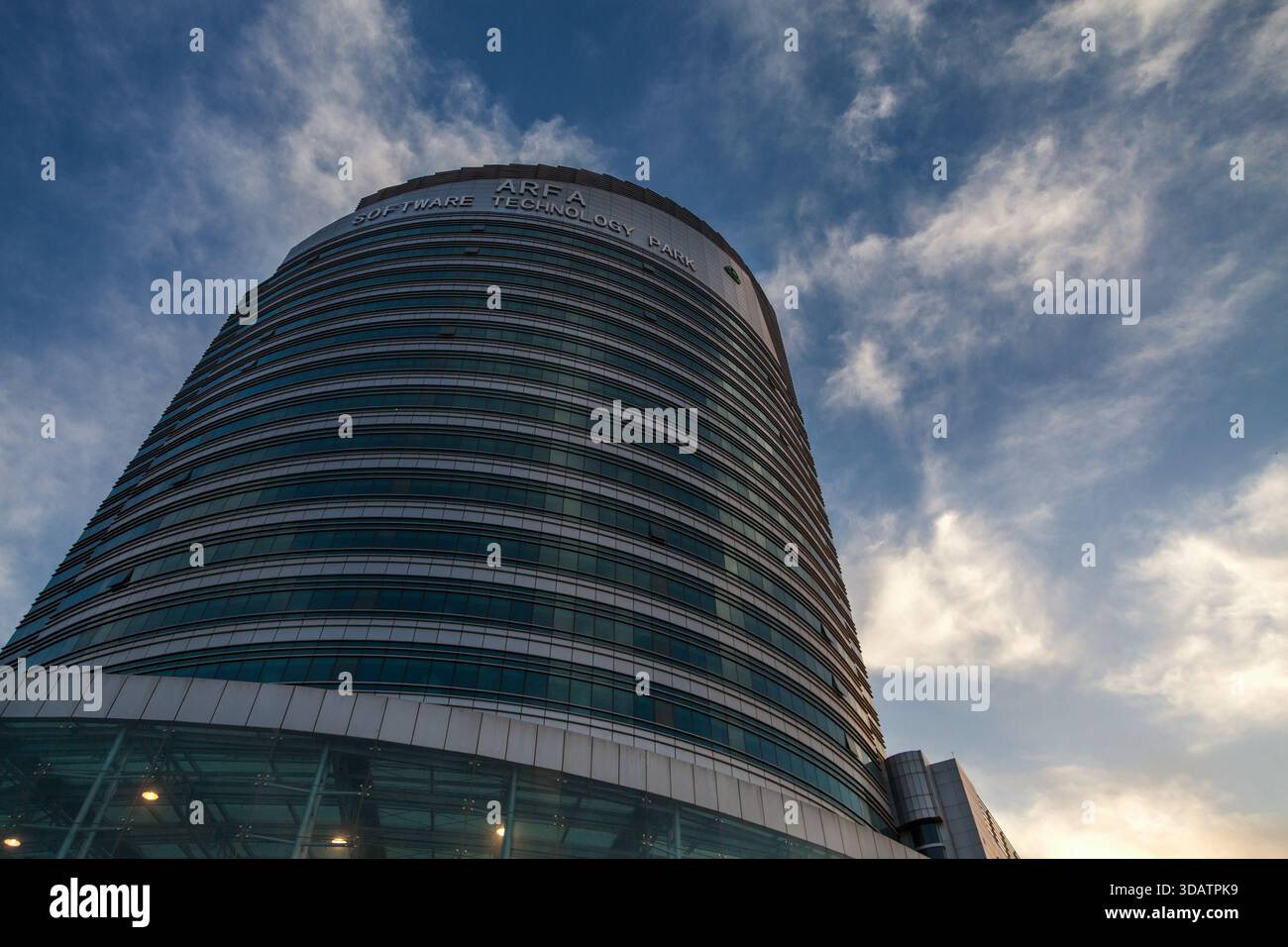 View of the modern Arfa Kareem Tower rises against a dynamic sky, its ...