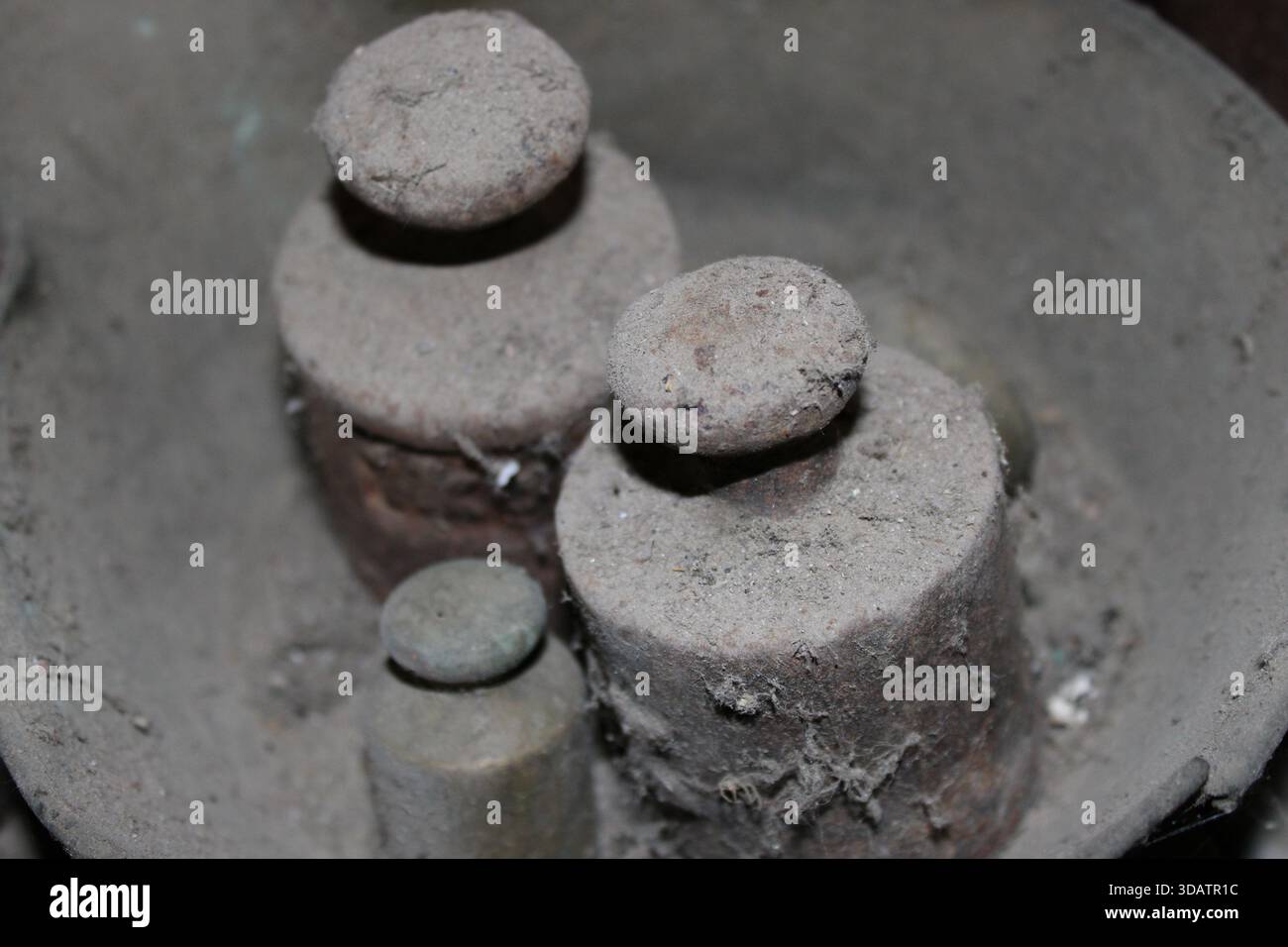 Two small, round objects are placed on top of each other inside a bowl ...