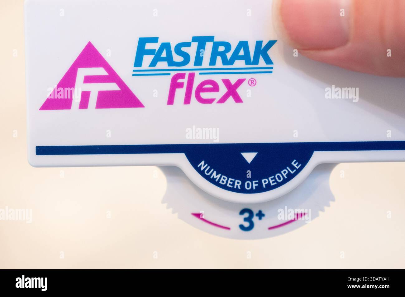 Person's hand holding a FasTrak Flex toll transponder for California ...