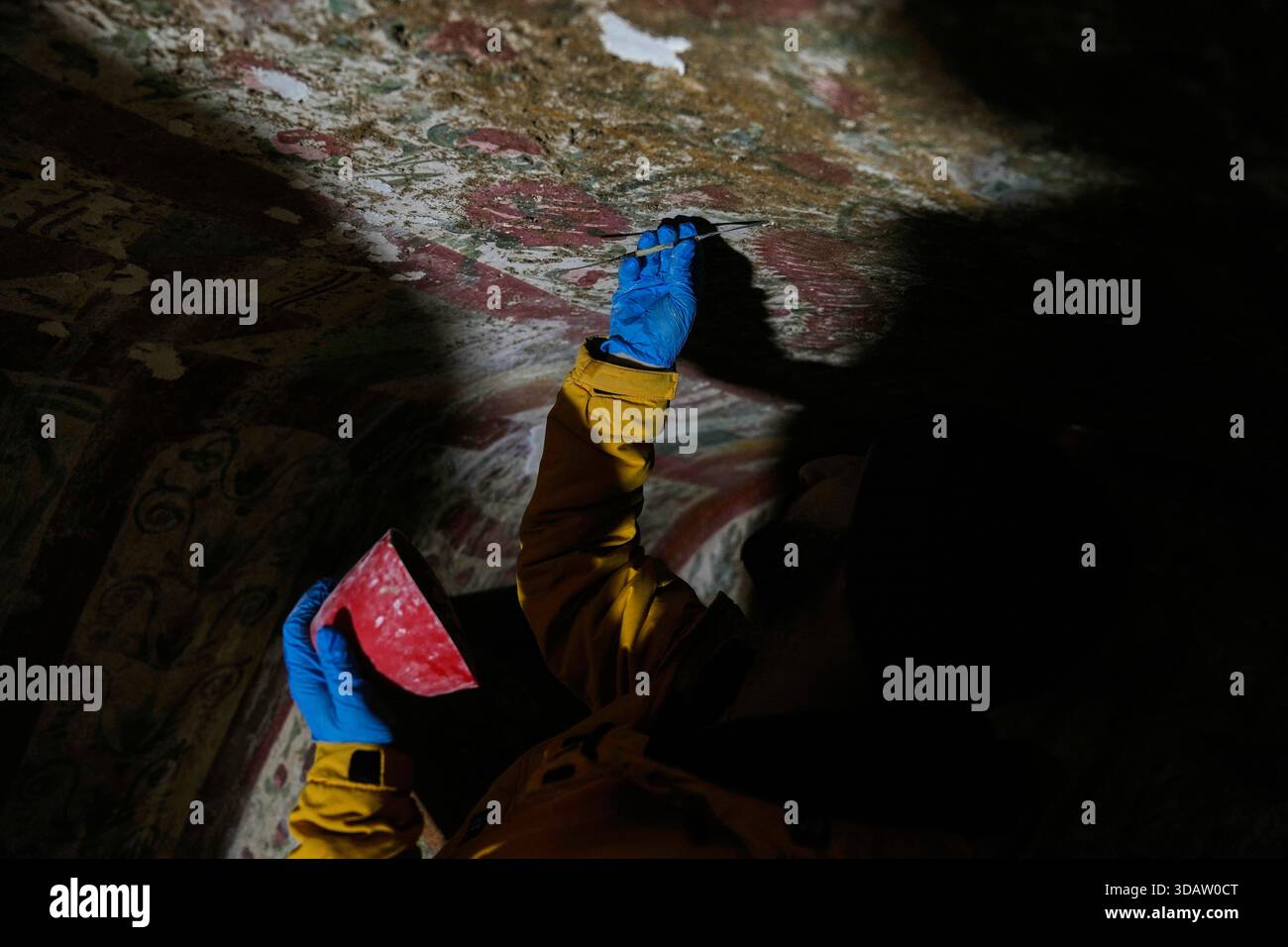Archaeologists clean and restore frescoes inside a 3rd-century tomb ...
