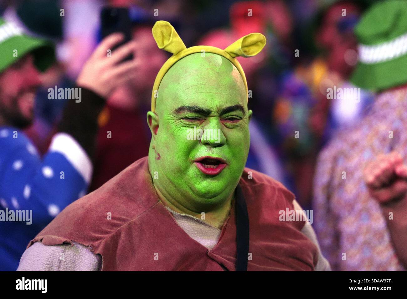 A fan dressed as character 'Shrek' reacts on day two of the Paddy Power ...