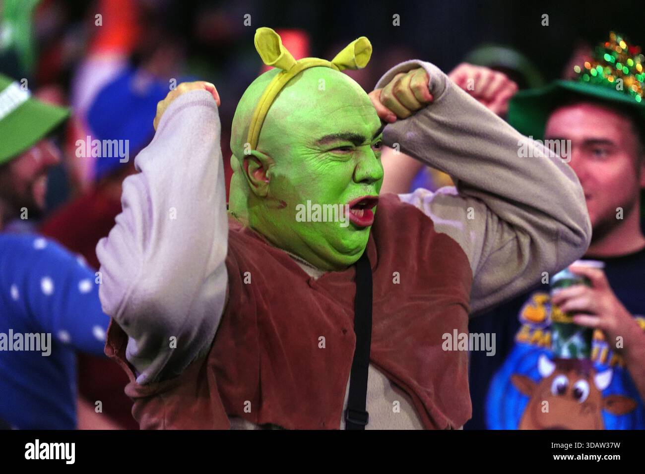 A fan dressed as character 'Shrek' reacts on day two of the Paddy Power ...