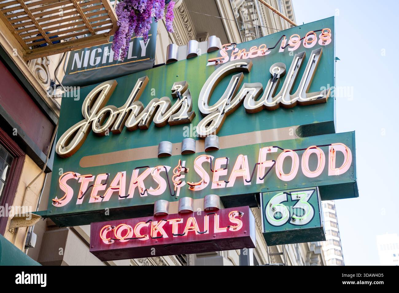 Close-up of vintage neon sign for John's Grill advertising steaks ...