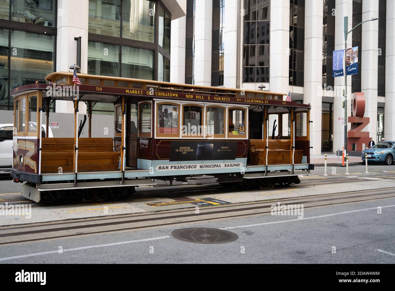 San Francisco Municipal Railway cable car No 56 on downtown tracks with ...